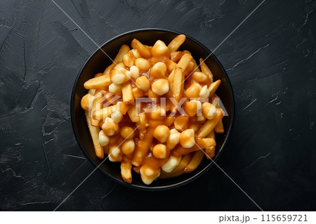 Traditional poutine in a black bowl, a staple...のイラスト素材 [115659721] - PIXTA