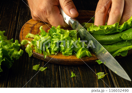 Close up of chef hands with knife. Cutting...の写真素材 [116032490] - PIXTA