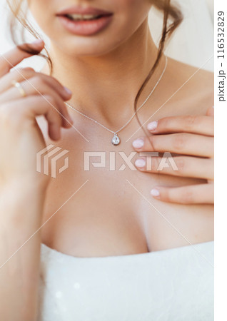 Wedding. Jewelry. The bride in a white dress...の写真素材 [116532829] - PIXTA