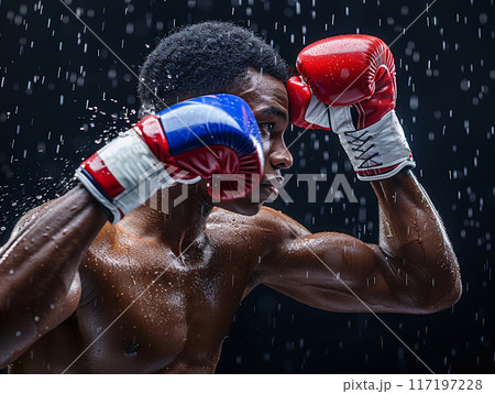 boxer, clad in gloves, stands in a darkened...のイラスト素材 [117197228] - PIXTA