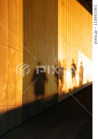 shadow of a man on wall during sunset. group of...の写真素材 [118663361] - PIXTA