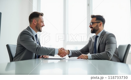 Two men in business suits sit across from each...のイラスト素材 [118733730 ...
