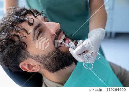 Bearded man patient during treatment procedure...の写真素材 [119264400] - PIXTA