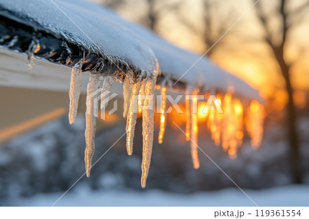 Icicles glow in the orange sunset light,...のイラスト素材 [119361554] - PIXTA
