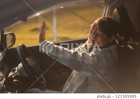 Caucasian woman gets scared while driving with...の写真素材 [121505993] - PIXTA