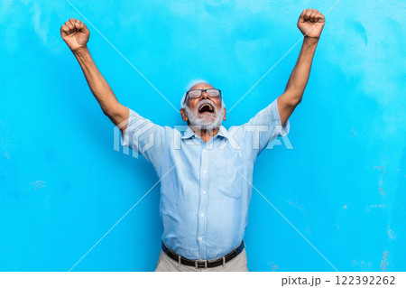 Elderly Arab man celebrating joyfully against a...のイラスト素材 [122392262 ...