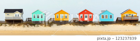 Colorful beach huts stand in a line on a sandy...のイラスト素材 [123237839 ...