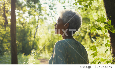 A peaceful scene of a person walking alone on a...のイラスト素材 [123263875 ...