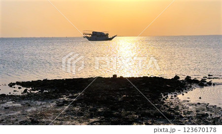 Traditional fishing boat floats gently beneath...の写真素材 [123670178] - PIXTA