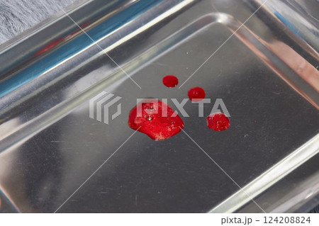 spilled blood on a tray in an operating room in...の写真素材 [124208824] - PIXTA