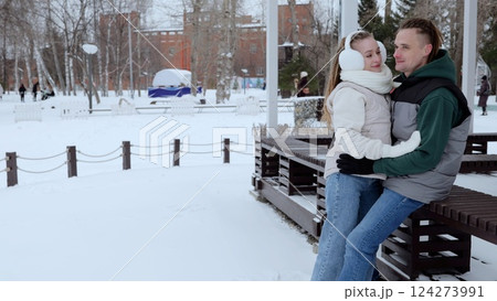 Loving couple hugging tightly on snow covered...の写真素材 [124273991] - PIXTA