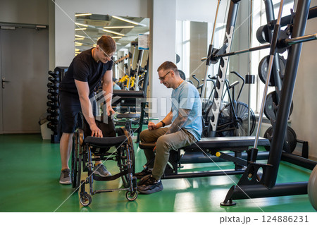 Supportive sports coach assists athlete in...の写真素材 [124886231] - PIXTA