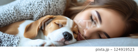 Cozy beagle puppy snuggles with young person in...のイラスト素材 [124919523 ...