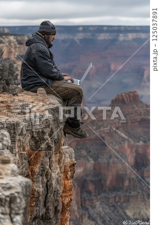 Man during hike sitting on a rock with a laptop...のイラスト素材 [125037891 ...