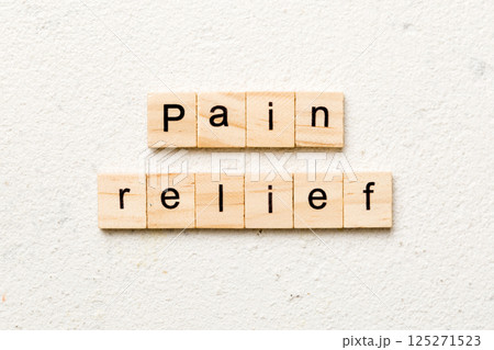pain relief word written on wood block. pain...の写真素材 [125271523] - PIXTA