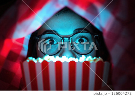 Captivated movie night: girl watching thriller...のイラスト素材 [126004272 ...