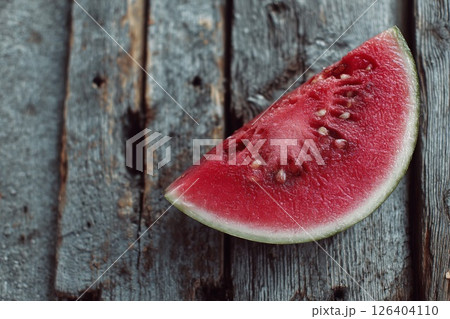 Red Watermelon Slice on Rustic Wooden Backgroundのイラスト素材 [126404110] - PIXTA