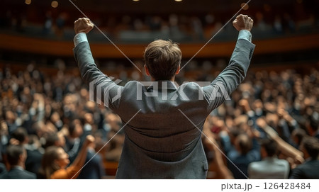 A confident leader inspiring a passionate crowd...のイラスト素材 [126428484 ...