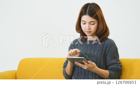 Asian woman using digital tablet shopping...の写真素材 [126700851] - PIXTA