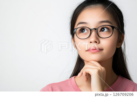 Young woman with glasses thinking thoughtfully...のイラスト素材 [126709206 ...