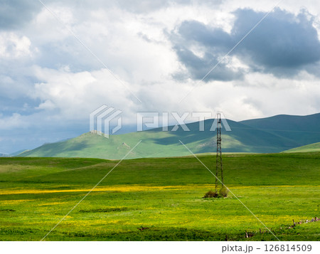 gray rainy clouds over green fields in Syunikの写真素材 [126814509] - PIXTA