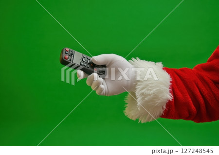 Santa Claus holding tv remote control. Santa...のイラスト素材 [127248545] - PIXTA