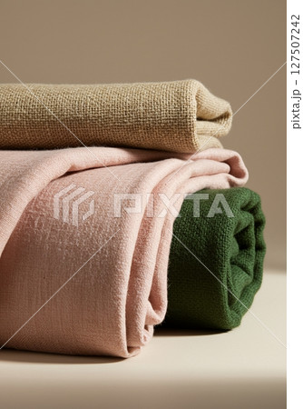 Rolled Beige Pink and Green Blankets on Neutral...のイラスト素材 [127507242 ...