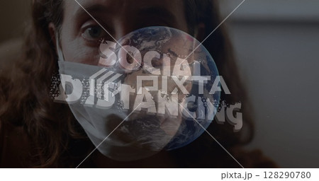 Woman wearing mask with Social Distancing text...の写真素材 [128290780] - PIXTA