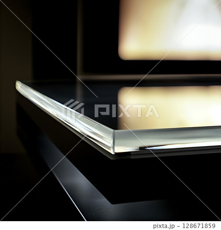 A glass table with a reflection of a television...のイラスト素材 [128671859 ...