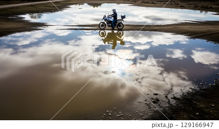 Motorcycle Reflected In A Puddle With Cloudy...のイラスト素材 [129166947] - PIXTA