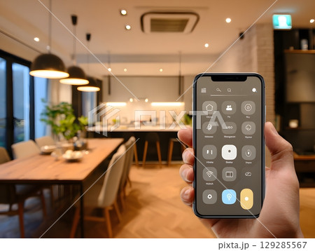 Hands hold a phone, controlling smart home...のイラスト素材 [129285567] - PIXTA