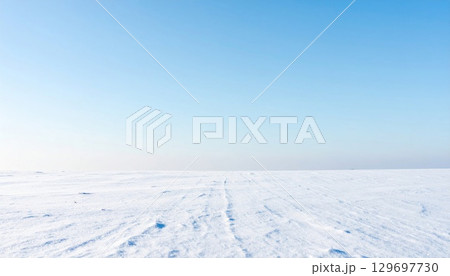 Icy White Snow Field Under a Bright Light Blue...のイラスト素材 [129697730 ...