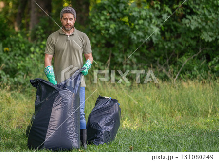 Man collecting plastic trash. Eco volunteer....の写真素材 [131080249] - PIXTA