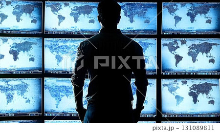 Silhouette of a man facing a wall of screens...のイラスト素材 [131089811] - PIXTA