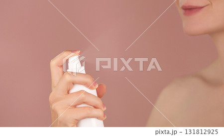 Skincare ads. Young woman sprays a facial spray...の写真素材 [131812925] - PIXTA