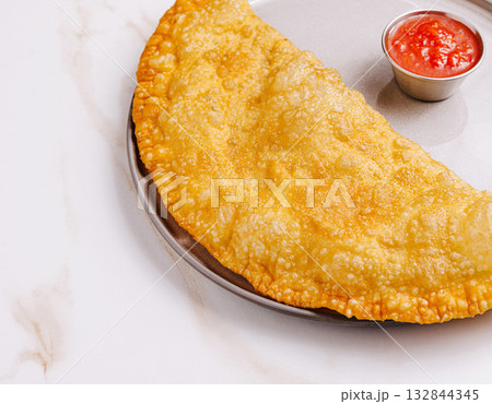 Crispy fried pastry accompanied by spicy...の写真素材 [132844345] - PIXTA