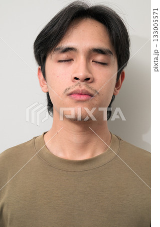 Portrait of handsome Young Asian Thai man eyes...の写真素材 [133005571] - PIXTA
