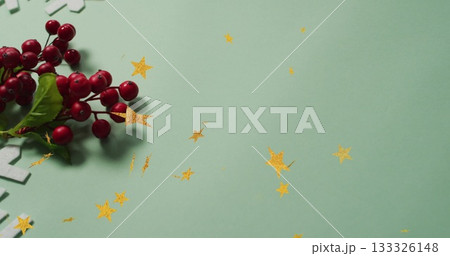 Arranging red berry sprig with green leaves on...のイラスト素材 [133326148 ...