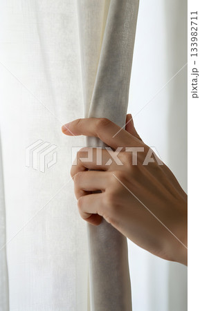 Hand Gently Holding Curtain in Soft Lightのイラスト素材 [133982711] - PIXTA